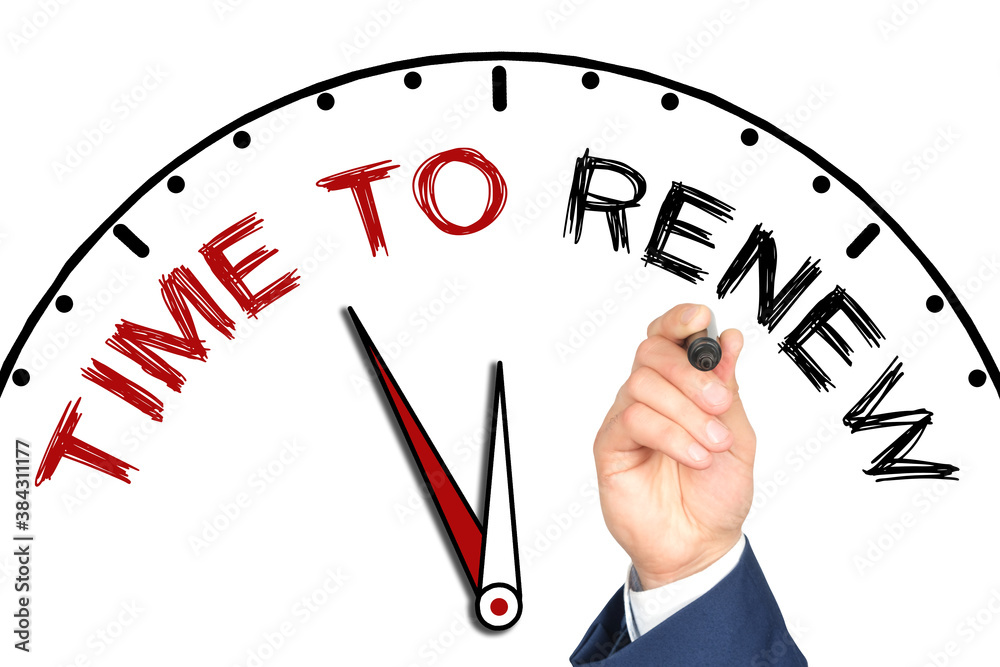 Hand writing TIME TO RENEW on drawn clock with marker on transparent ...