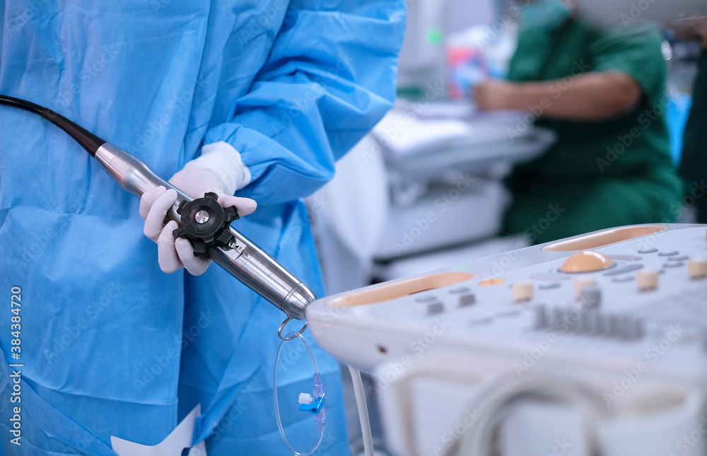 Cardiologist holding transesophageal ultrasound probe and use ...