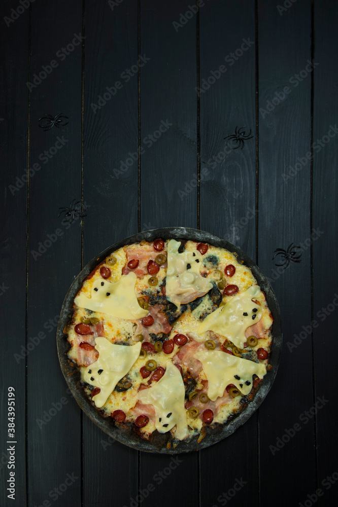 Scary Halloween black dough pizza slices with ghosts On white marble ...