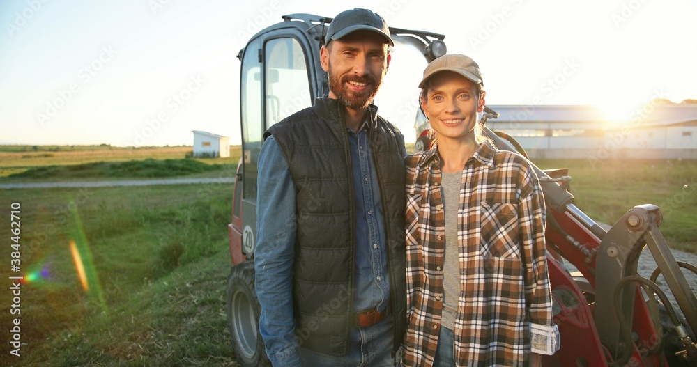 Portrait Caucasian happy couple of married farmers standing in hugs at ...