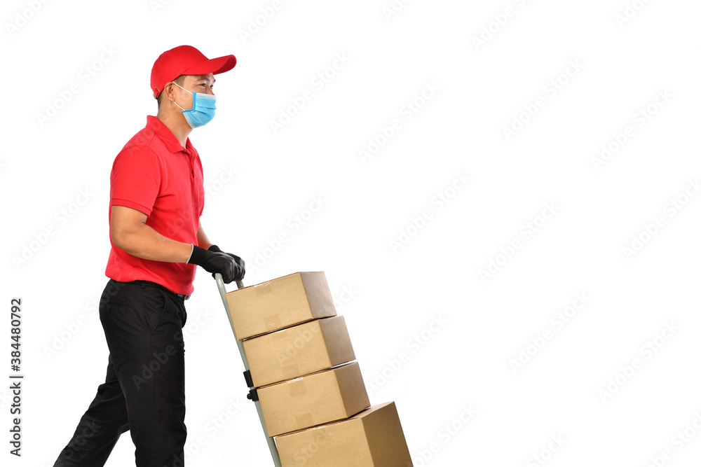 Happy young Asian delivery man in red uniform, medical face mask ...