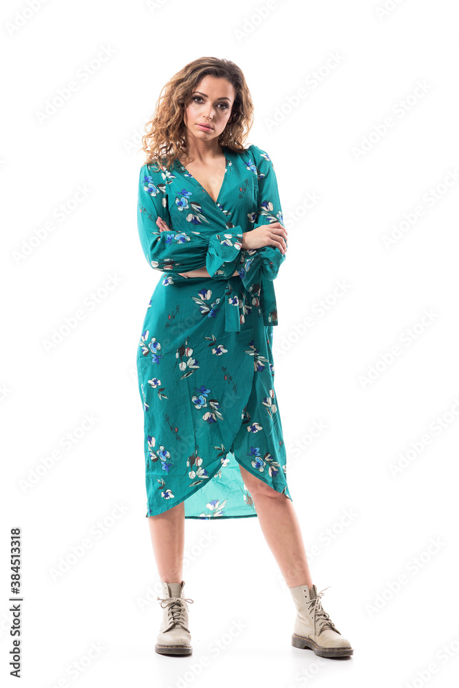 Disappointed unhappy strict young woman with crossed hands looking at ...