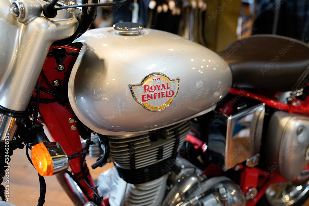 Royal Enfield logo and sign text on grey retro motorcycle fuel tank of ...