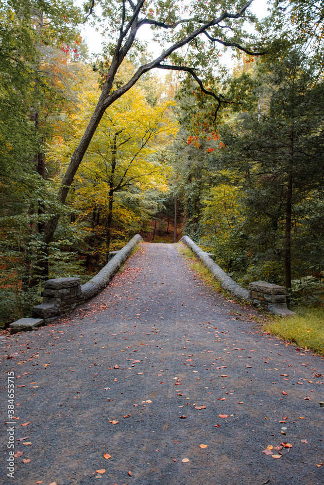 Stone Bridge path in Rockefeller State Park passing over the Pocantico ...