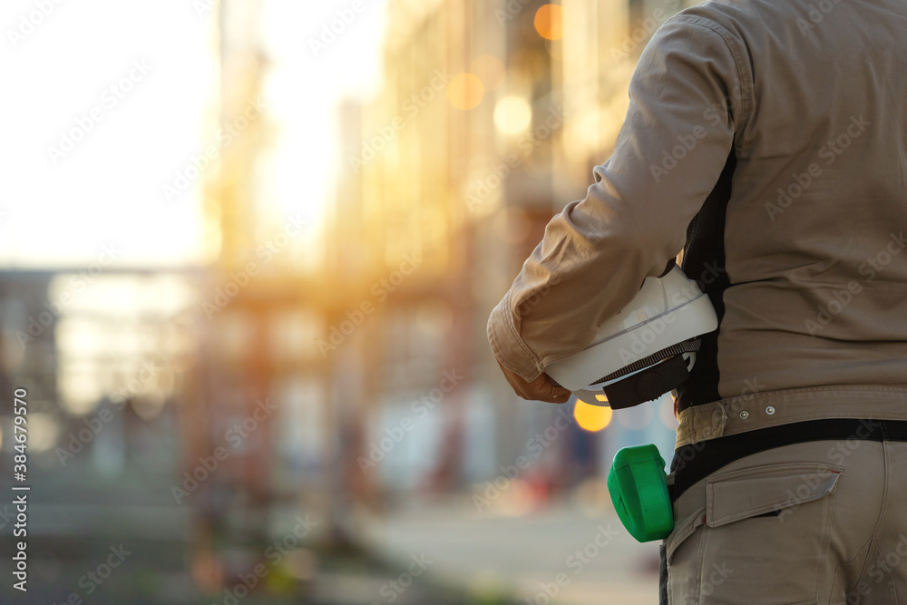 Refinery Industrial engineer stand hold helmet in oil and gas refinery ...