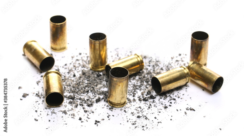 9mm pistol bullet casings with gunpowder pile isolated on white ...