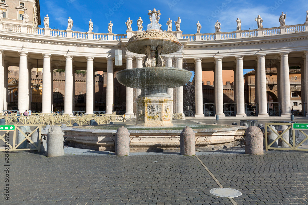 Colonnade and fountain on St.Peter's Square in front of Saint Peter's ...