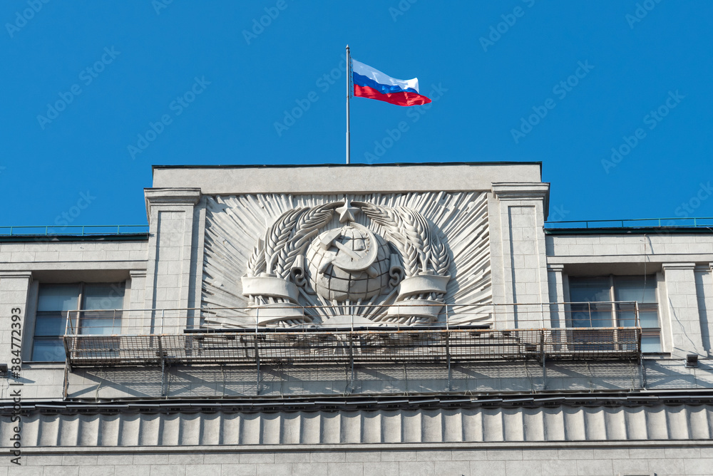 Soviet coat of arms on the wall on top of the State Duma building in ...