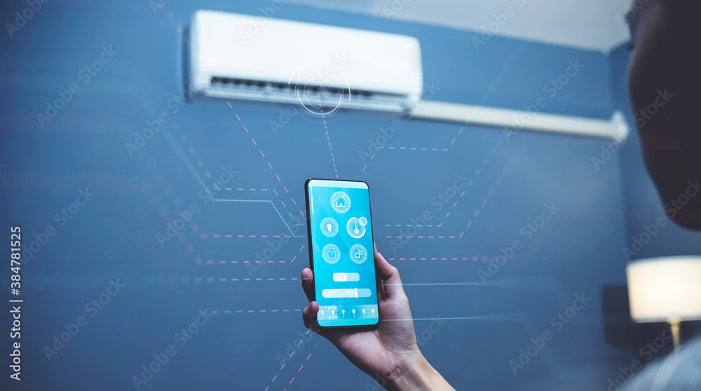 Smart home modern technology Asian girl sitting living room using ...