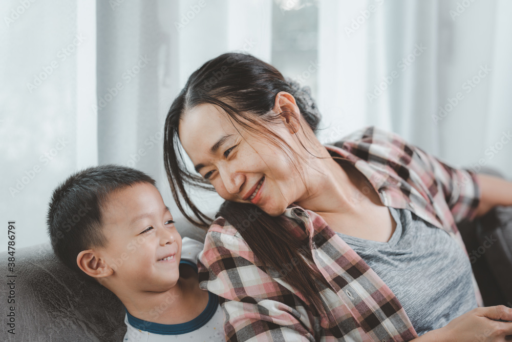 Loving mother smiling cute funny kid boy having fun together, happy ...