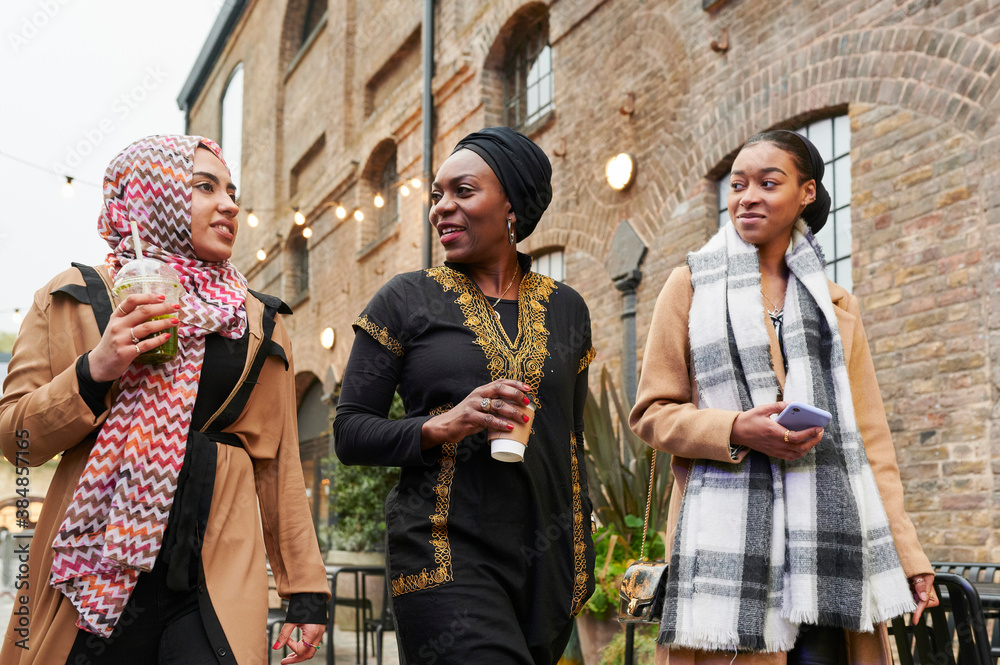 Muslim woman walking in the city Stock Photo | Adobe Stock