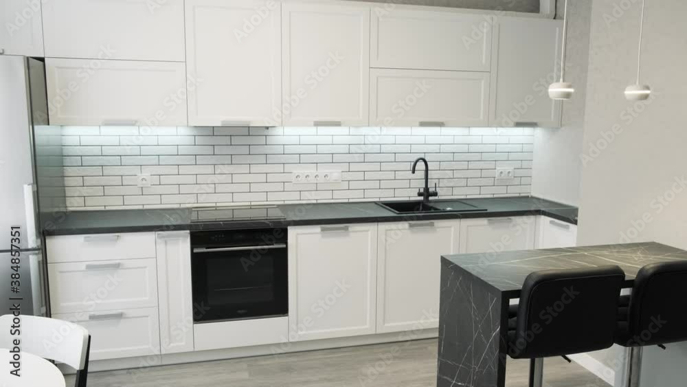 Elegant modern kitchen with white walls. Light interior of a white ...