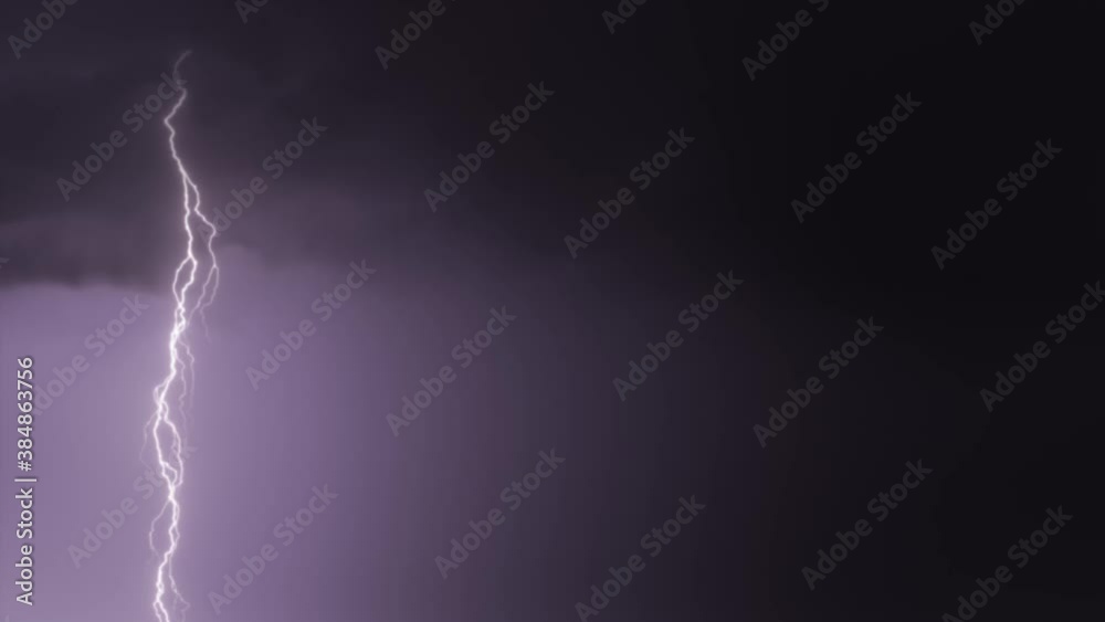 Vidéo Stock Realistic lightning flashes in the dark night sky. Powerful ...