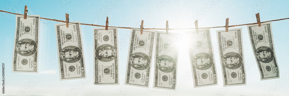 Money laundering concept banner. Panoramic of US dollards hanging to ...