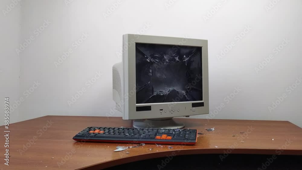 Vidéo Stock An old monitor sitting on a table is smashed with a hammer ...