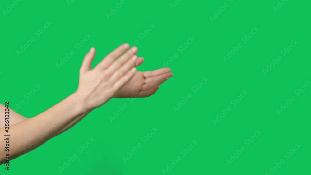 Hands are clapping on green screen background. Female hands silhouette ...