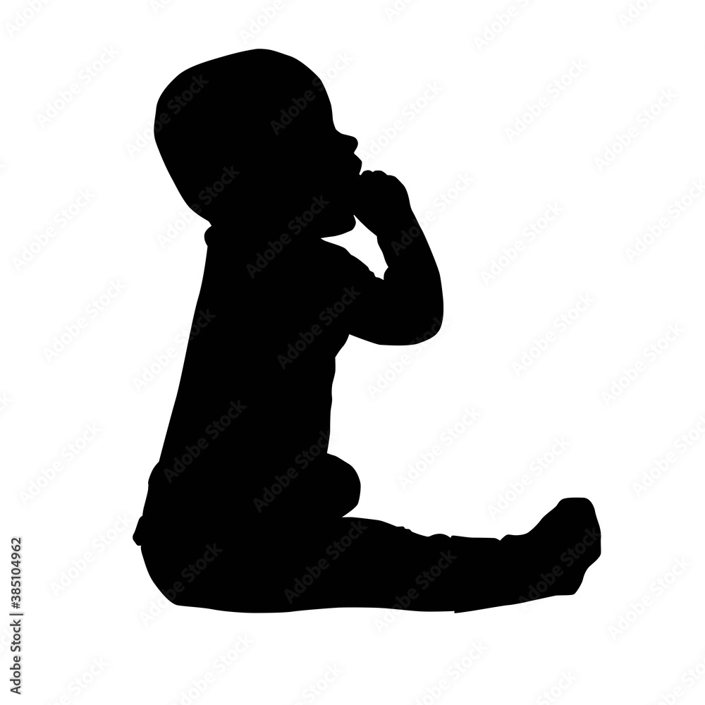 eight months baby sitting from profile with one hand in mouth, child ...