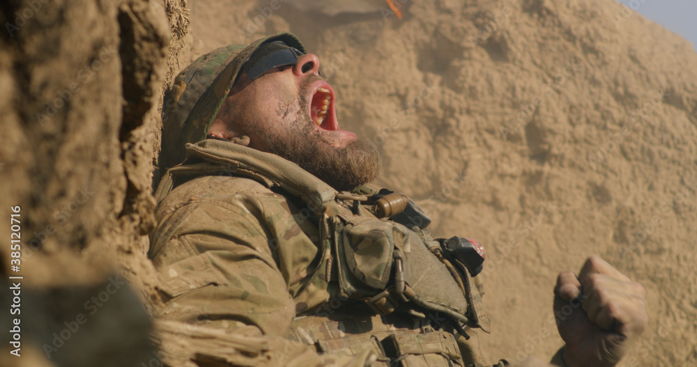 Scared fighter hiding in trench during war Stock Photo | Adobe Stock