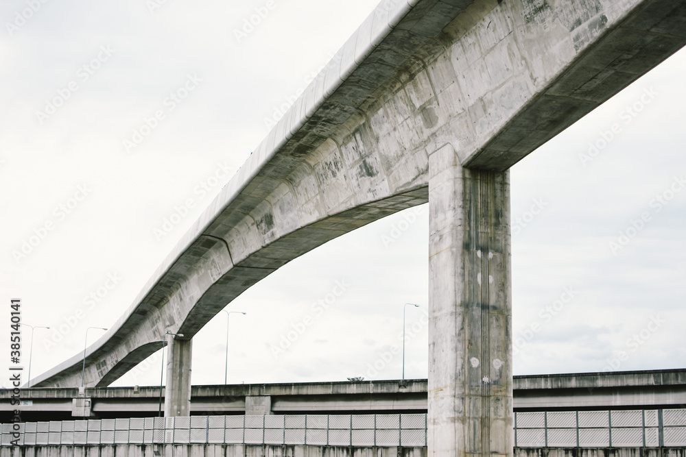 Bottom view of BTS Skytrain route under sky clouds in Bangkok, Thailand ...