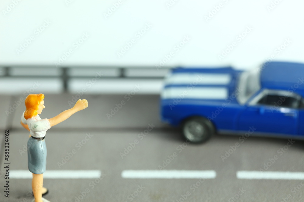 Miniature figure model put on the road plate model scene represent road ...