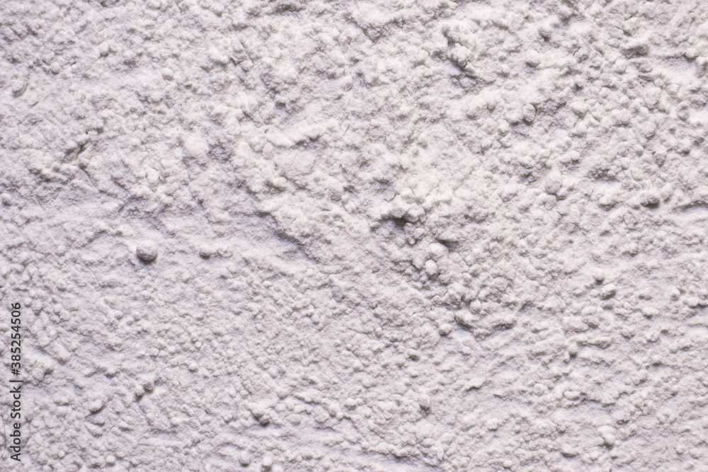 Texture of white fine flour powder with small ball lumps. Can be seen ...