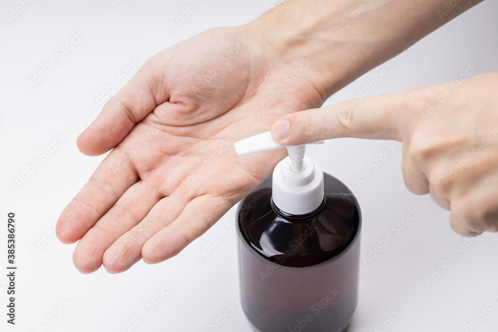 caucasian person applying soap for washing hands. hygiene concept ...