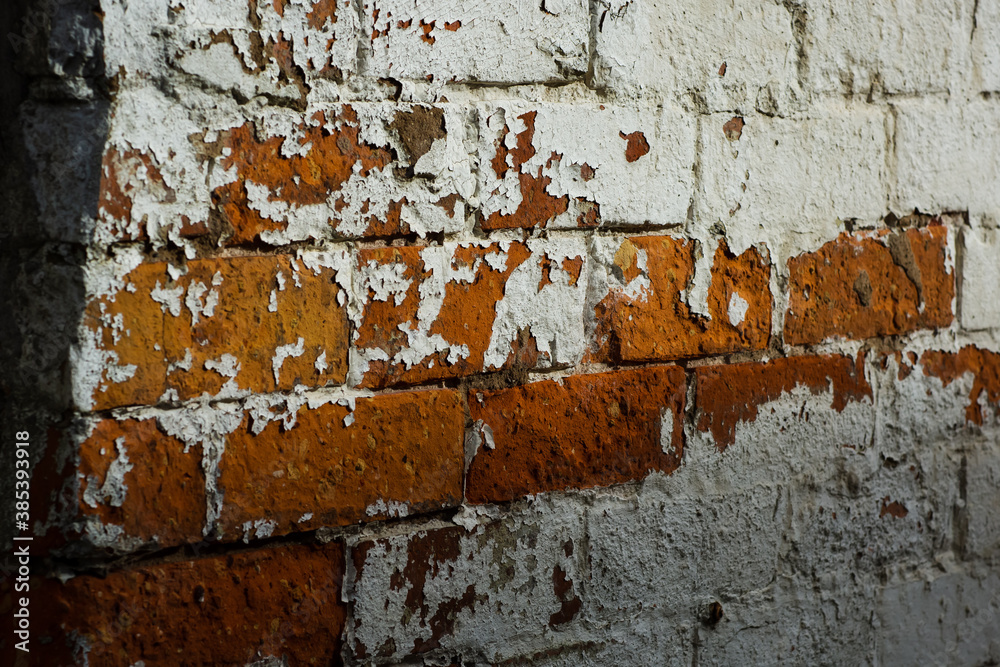 Flaking peeling paint coatings on a brick wall Stock Photo | Adobe Stock