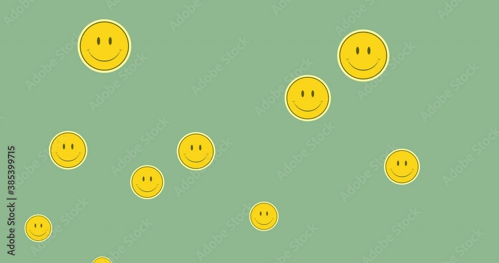 Multiple smiley face emojis floating against green background Stock ...