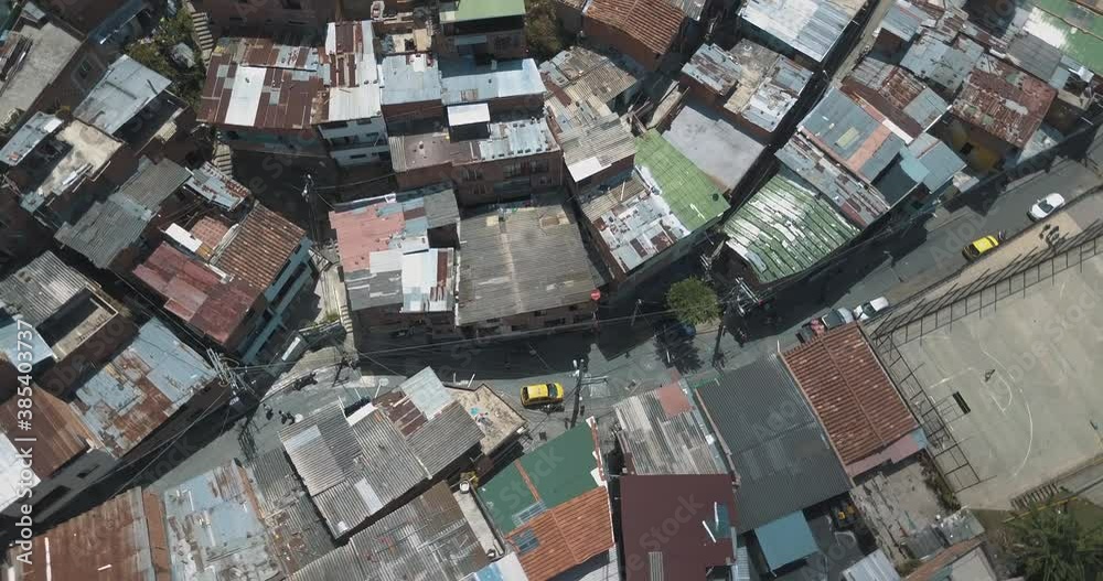 Drone aerial, flying low, bird's-eye view of ghetto slums in a poor ...