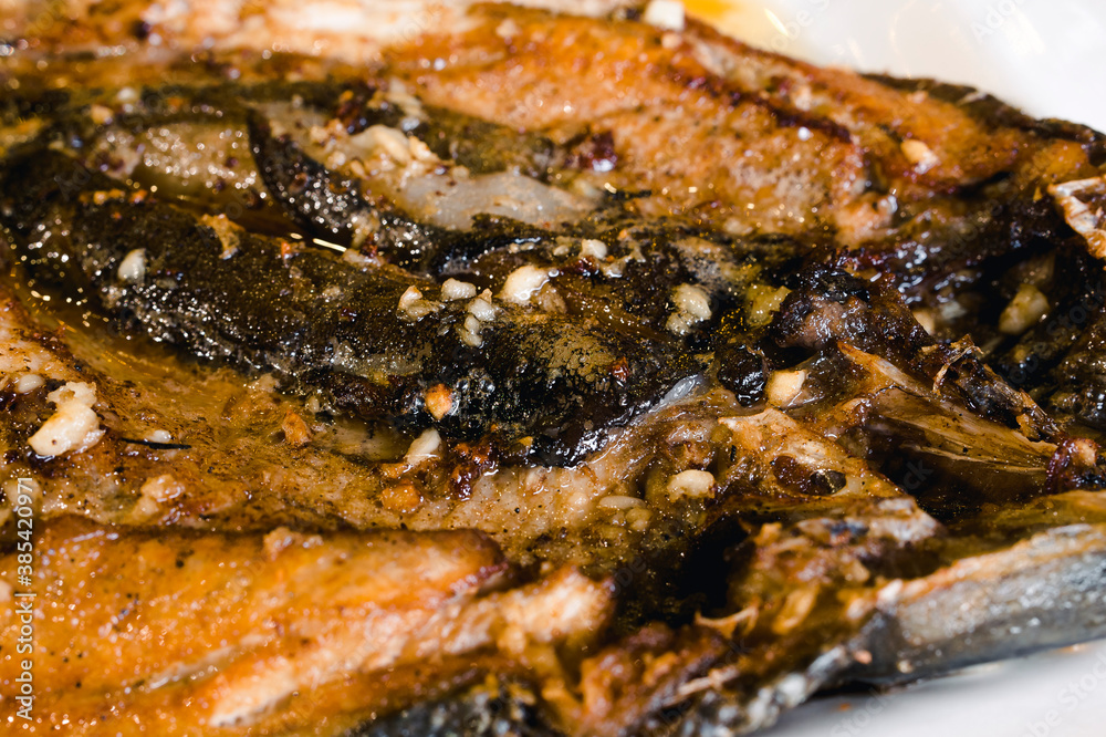 Closeup of Fried boneless Bangus (Milk Fish) with garlic bits. Stock ...