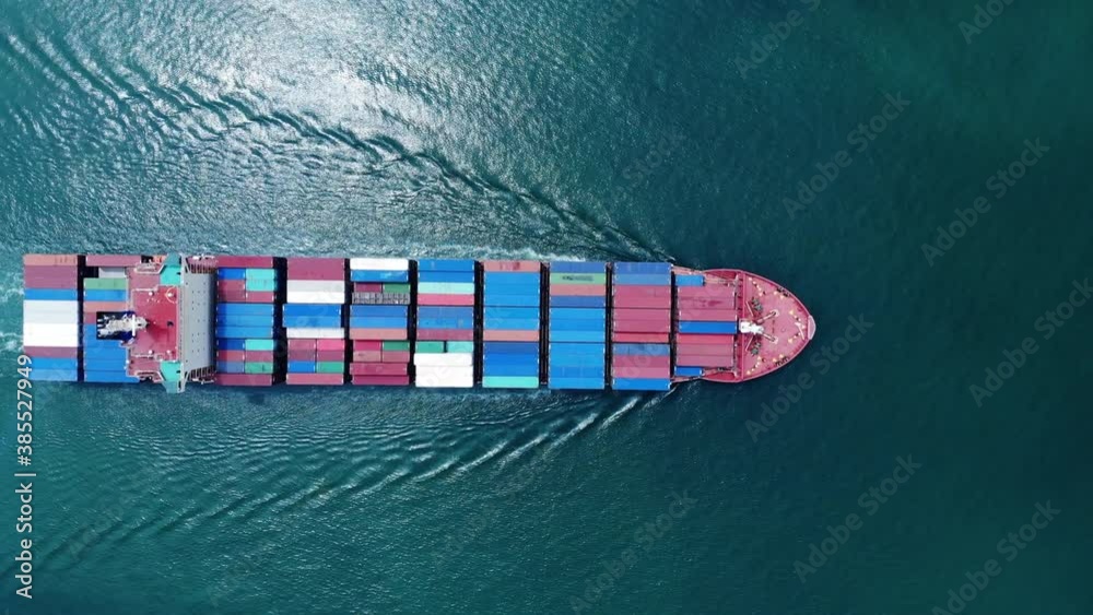 Aerial top view of cargo ship carrying container running for export ...