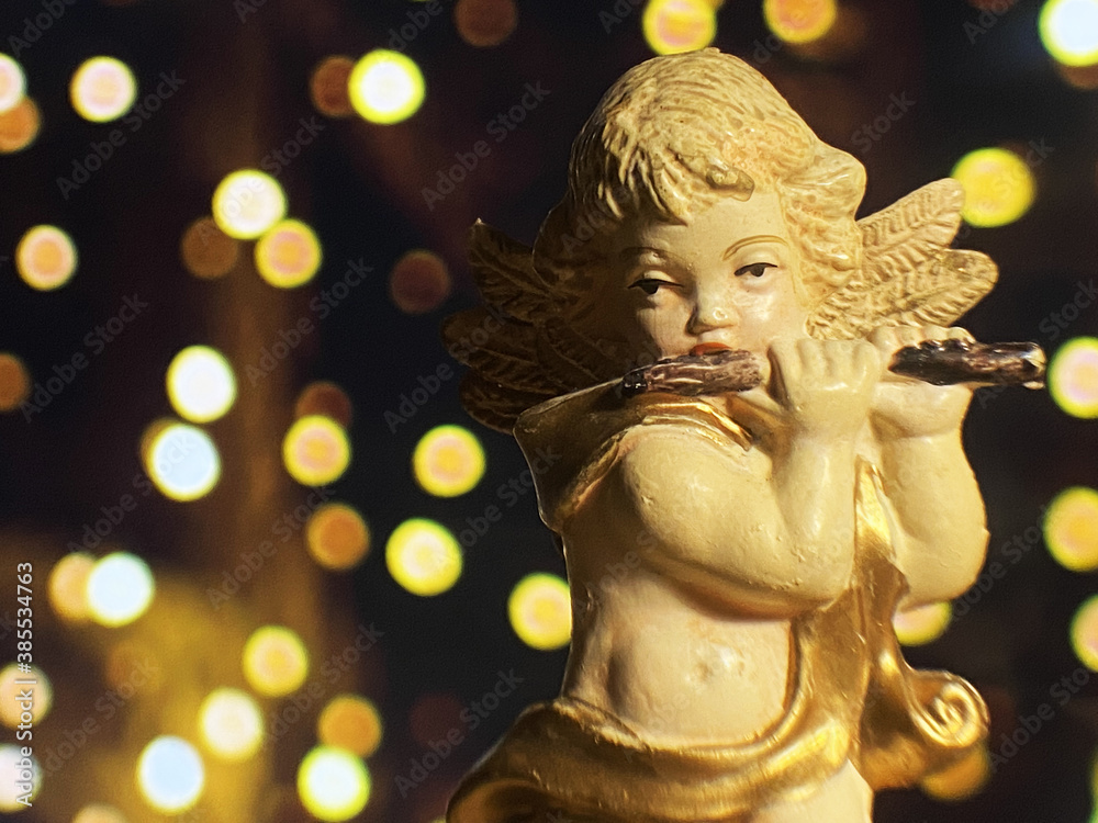 Violin angel. Vintage angel figurine, with bokeh effect background ...