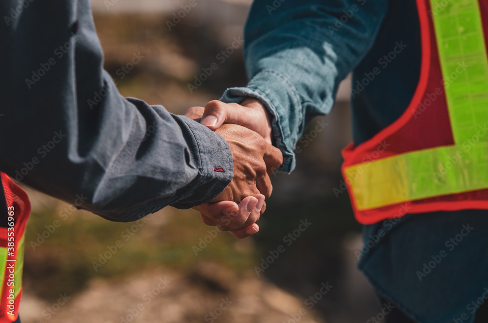 Shake hand concept, Engineer hands shake at work place building ...