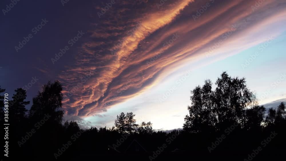 Miraculous timelapse panorama of sunset above black forest silhouette ...