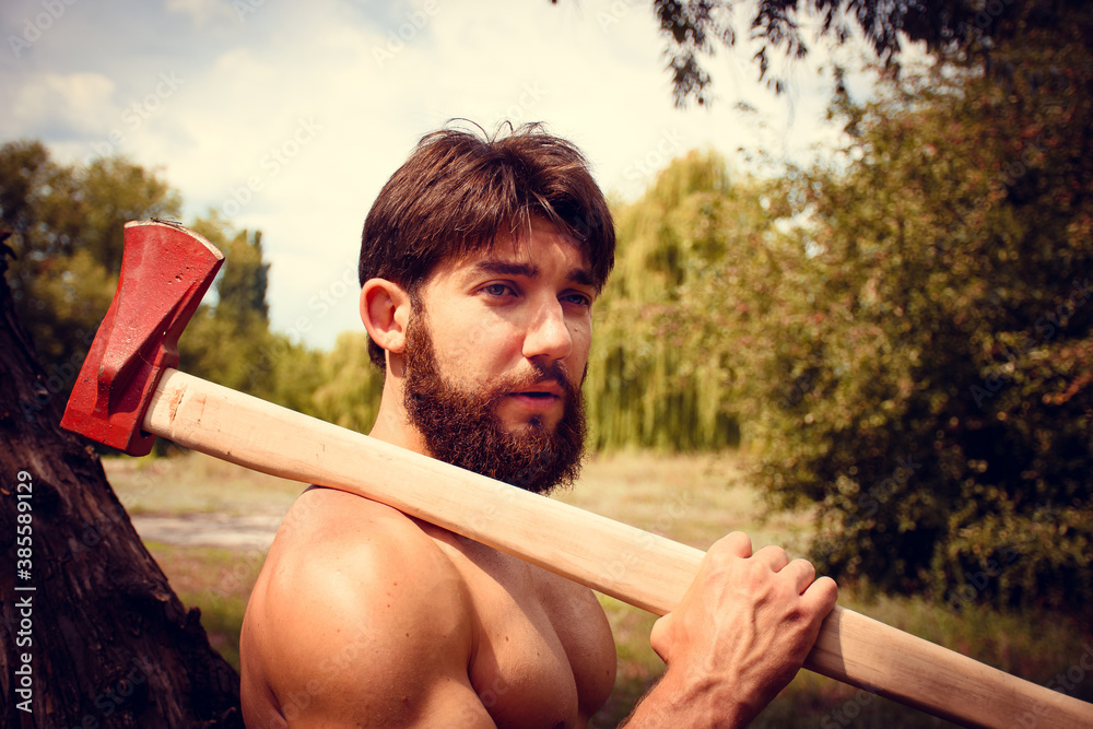 Handsome shirtless young man with axe Stock Photo | Adobe Stock