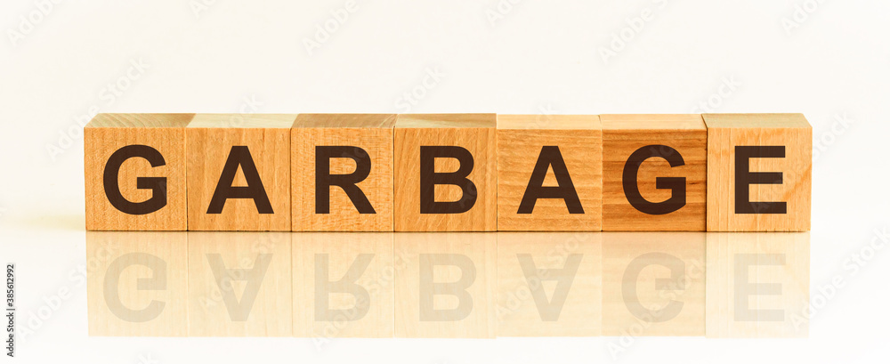 Wooden Blocks with the text: Garbage. The text is written in black ...