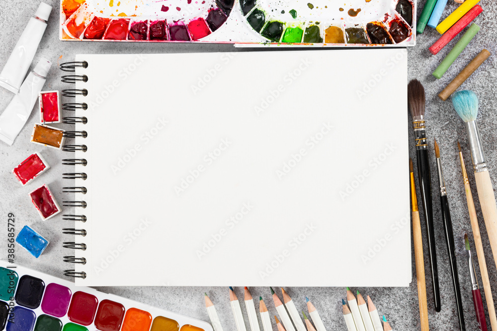 Artist workspace on gray stone background. Stock Photo | Adobe Stock