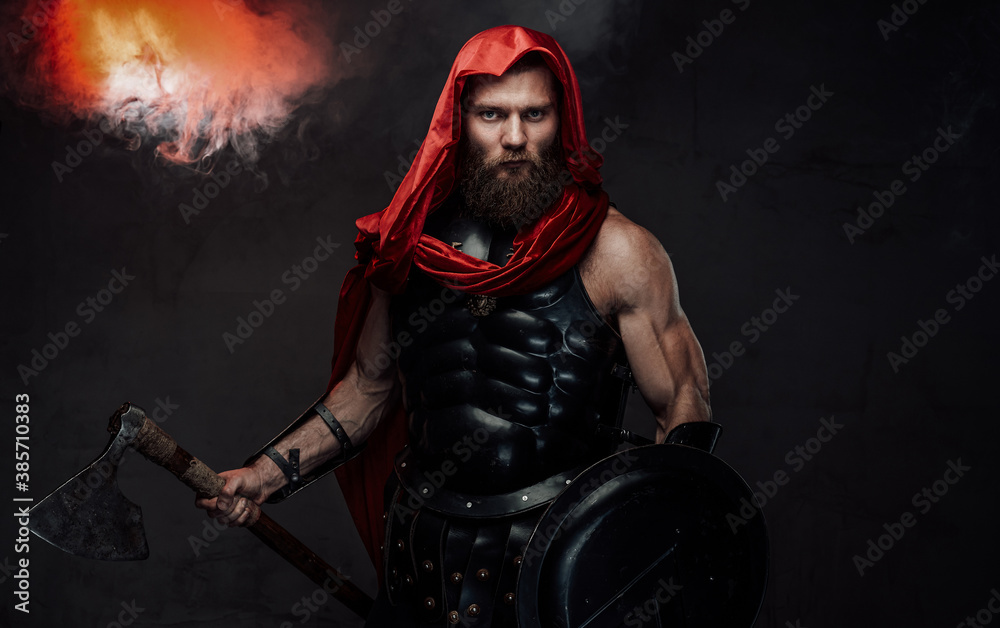 Military bearded roman in red hood and dark armor which holding an axe ...