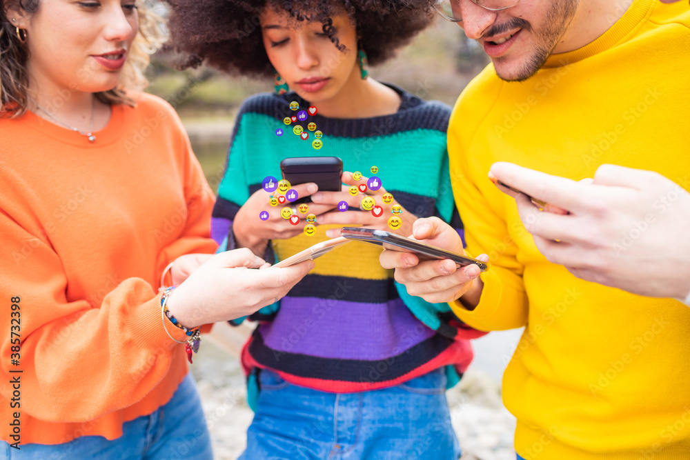 Group of multiethnic friends millennials using mobile phones - Young ...