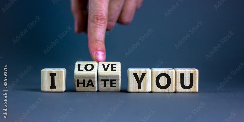 Hand turns cubes and changes the expression 'I hate you' to 'I love you ...