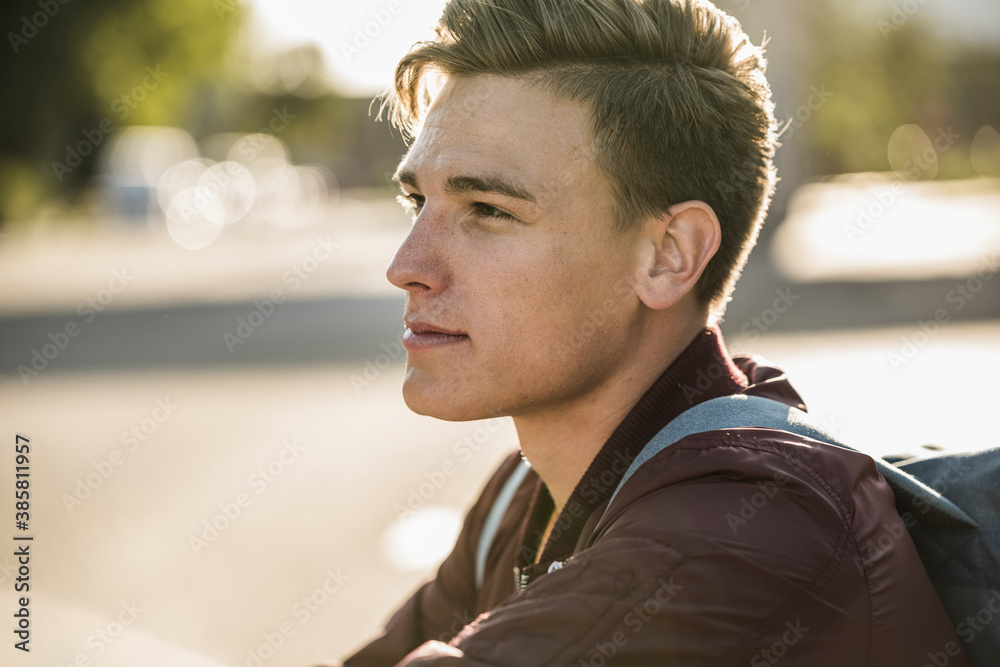 Thoughtful handsome young man looking away Stock Photo | Adobe Stock