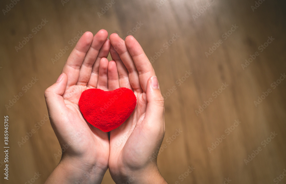 Red heart in hands symbolizing healthcare and self-love. health, love ...