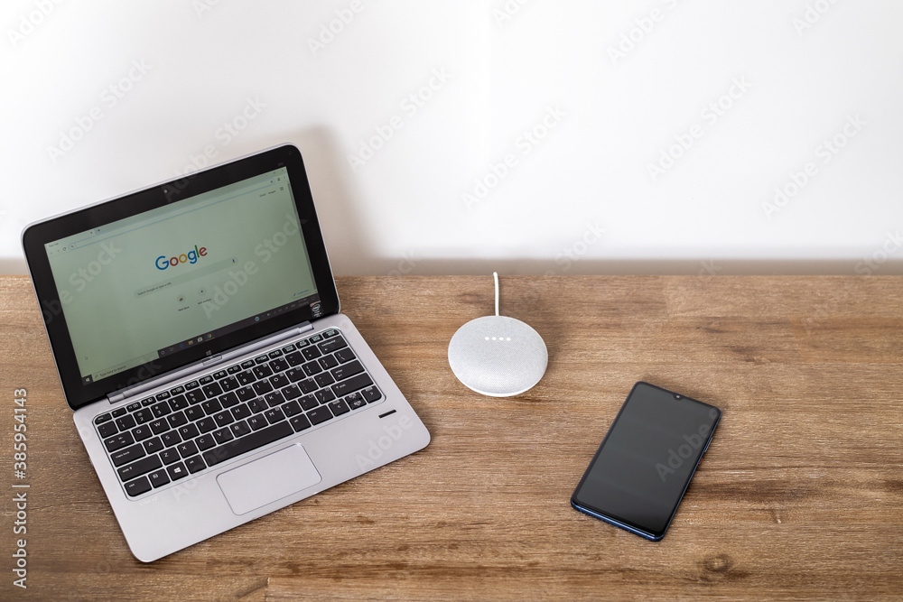 Foto Stock Adelaide, Australia - July 7, 2019: Google Home Mini with HP ...