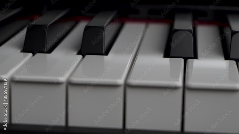 Vidéo Stock Close up of a black and white piano keys. Slow motion shot ...