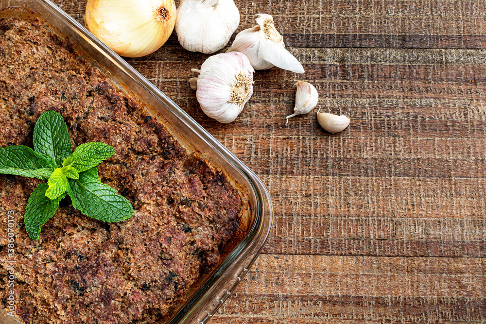 Roasted kibe in the glass bowl with mint, garlic and onion. Brazilian ...