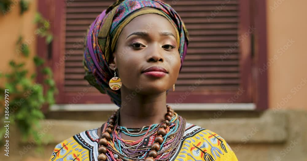 Close up of the face of the pretty young African woman in the ...