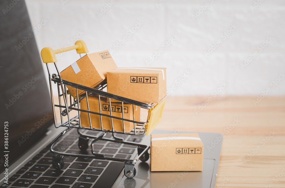 Online shopping and delivery service concept.Brown paper boxs in a ...