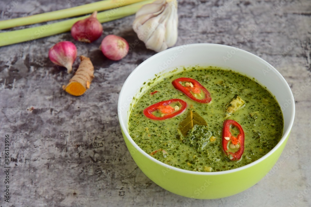 Daun ubi tumbuk or daun singkong or pounded and seasoned cassava leaves ...
