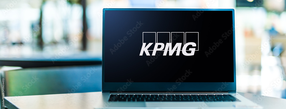 Laptop computer displaying logo of KPMG Stock Photo | Adobe Stock