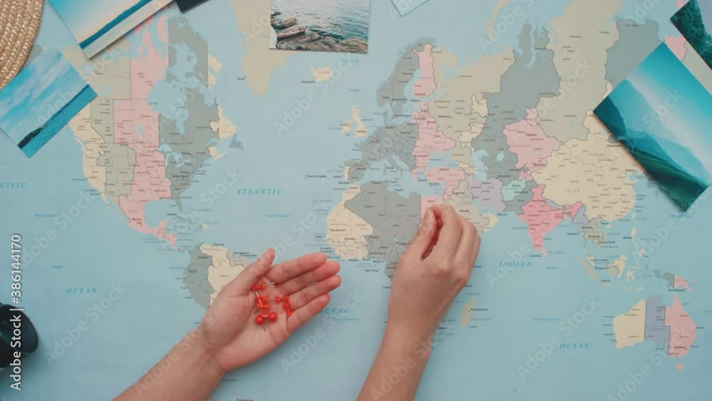 Horizontal top view flat lay footage of female hands holding thumbtacks ...